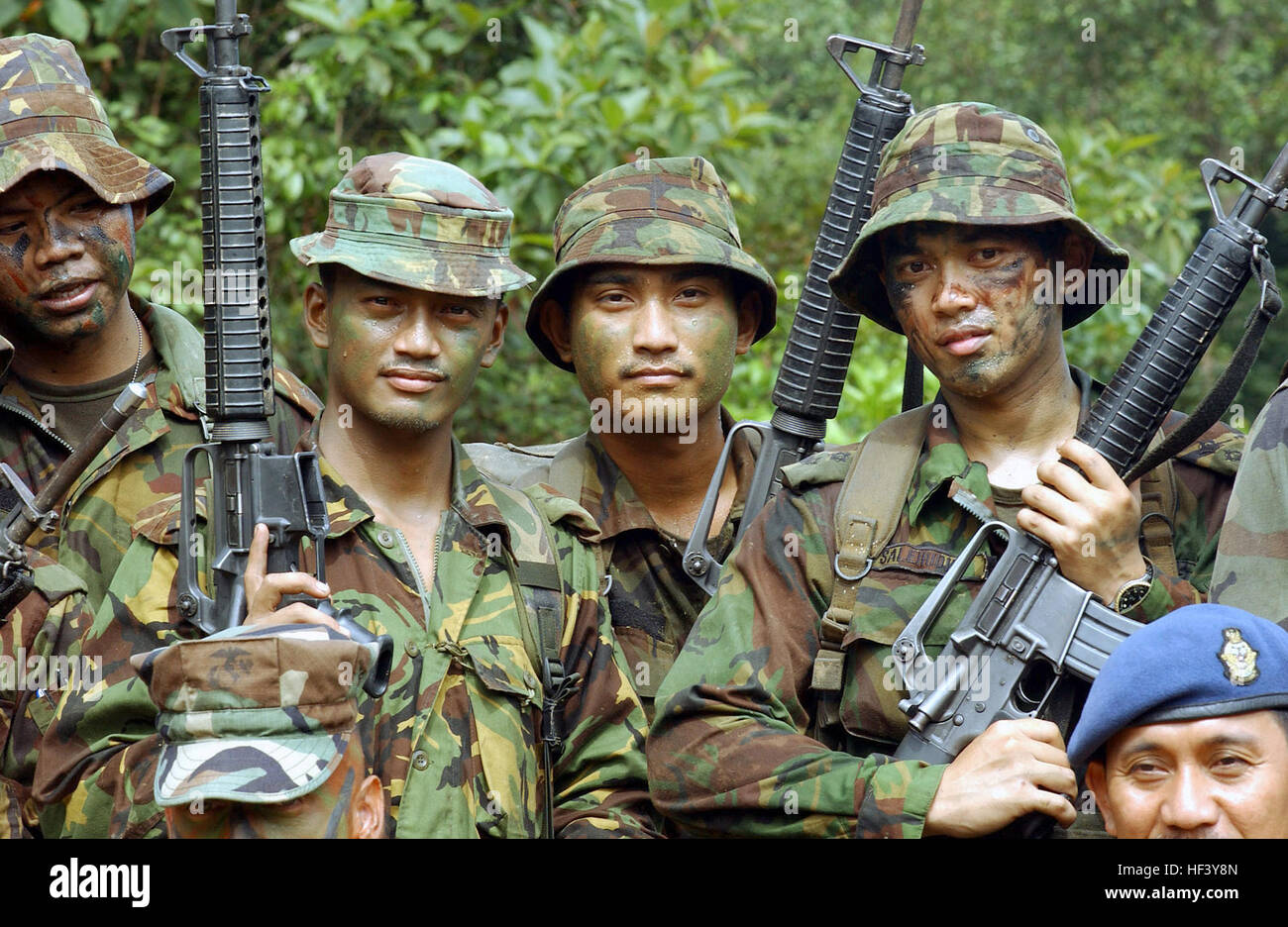 In the jungles of Brunei Darussalam, Royal Brunei Army members pose for ...