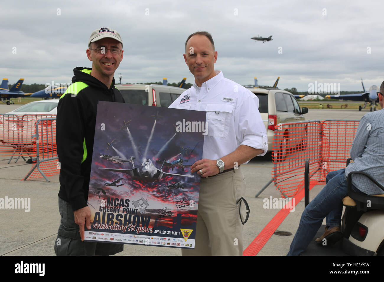 Col. Chris Pappas III, air station commanding office, right, presents ...