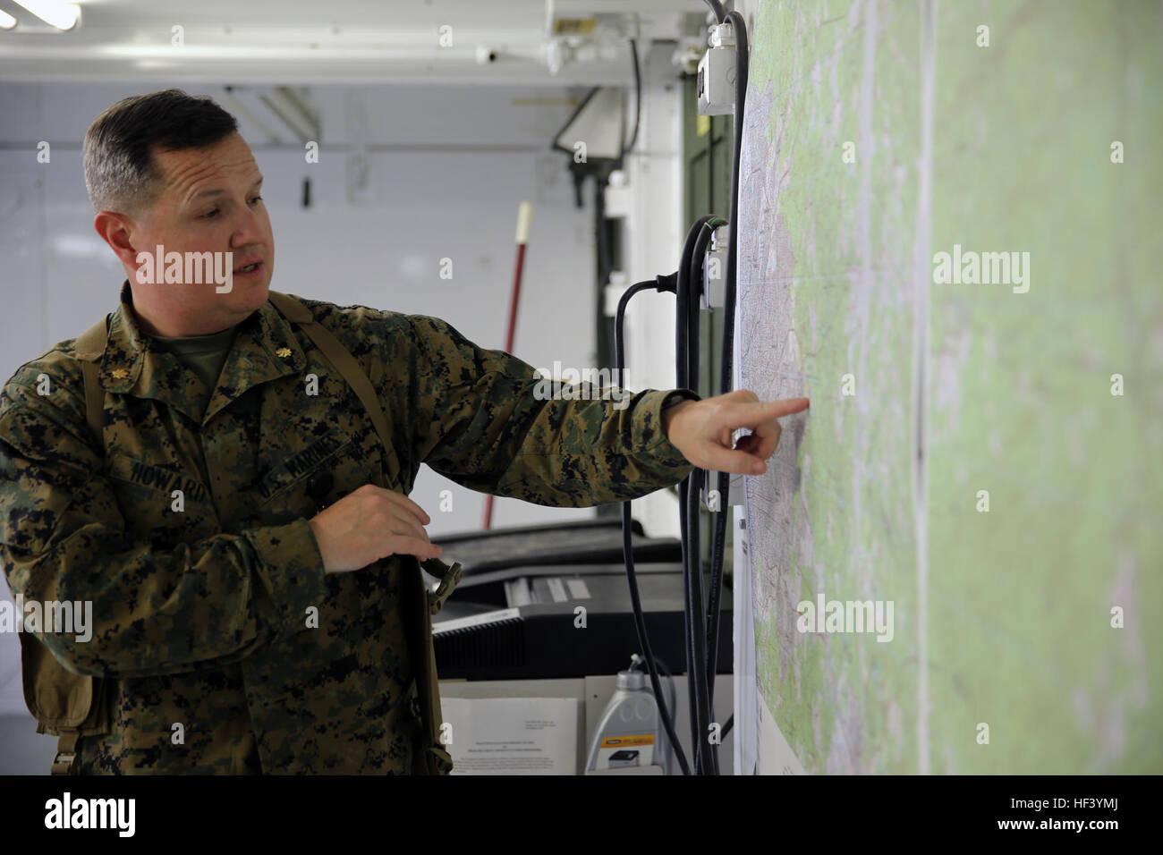 A Marine Air-Ground Task Force Planner reviews a map during a Marine ...