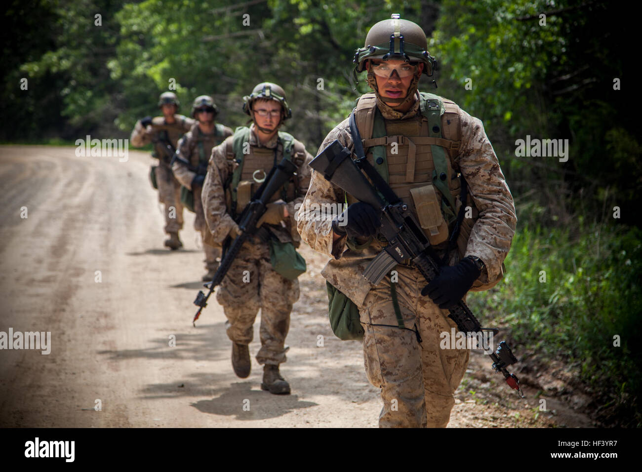 U.S. Marines attending the Military Police Basic Course, conduct foot ...