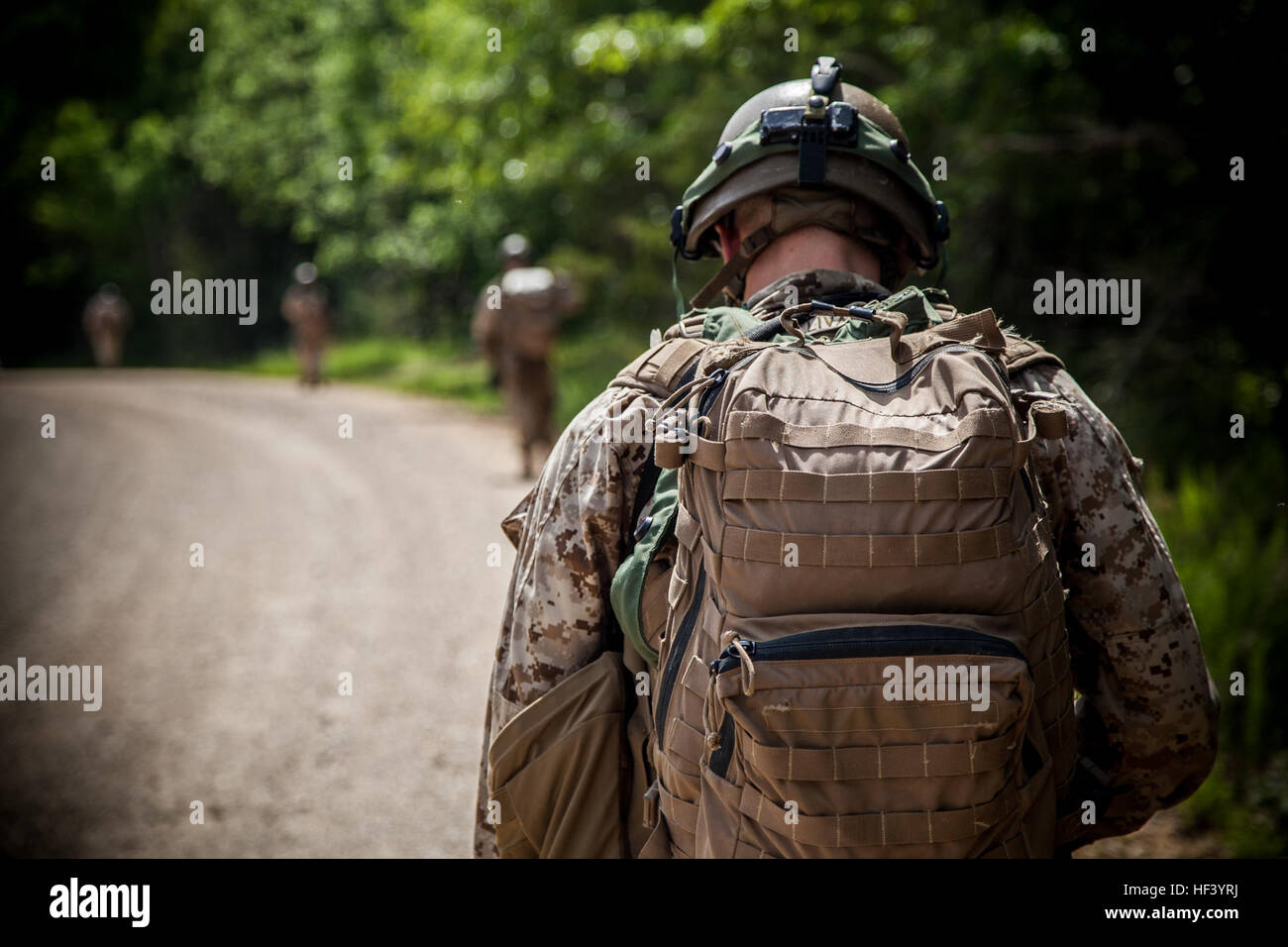 U.S. Marines attending the Military Police Basic Course, conduct foot ...