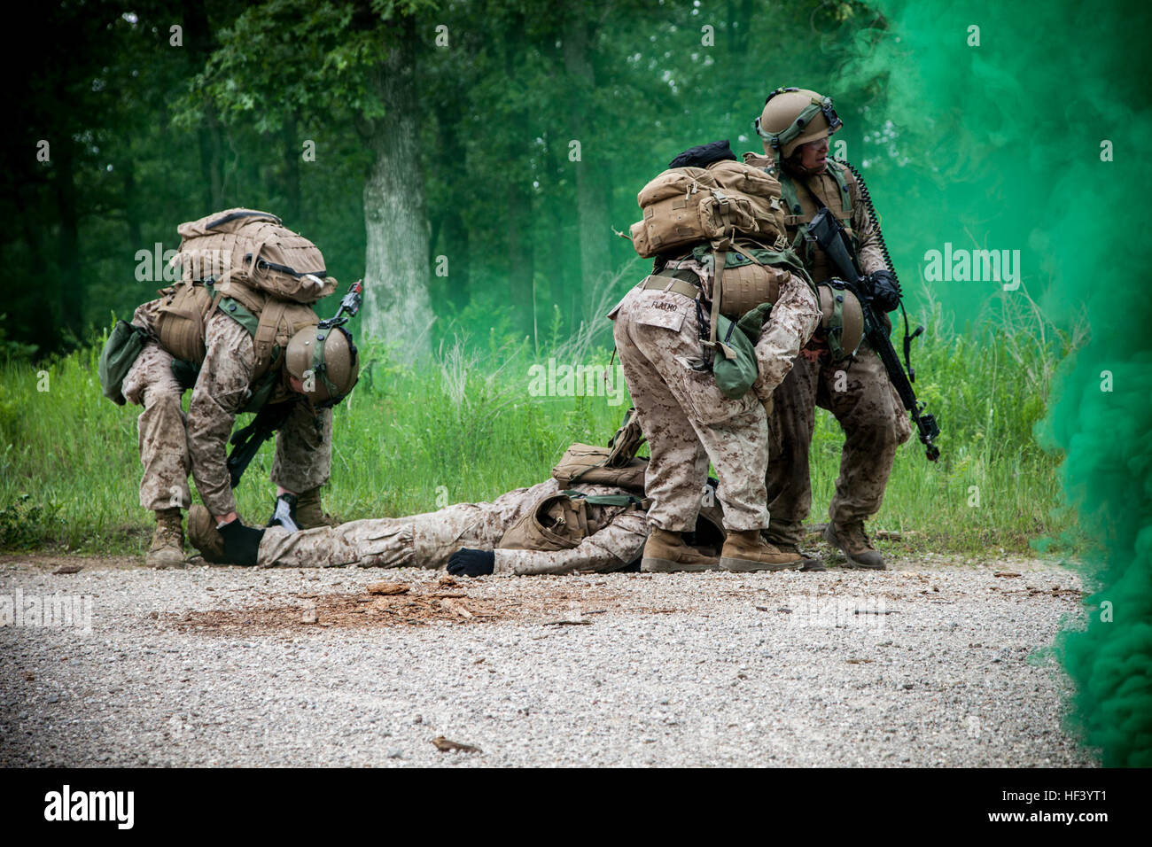 U.S. Marines attending the Military Police Basic Course, evacuate a ...