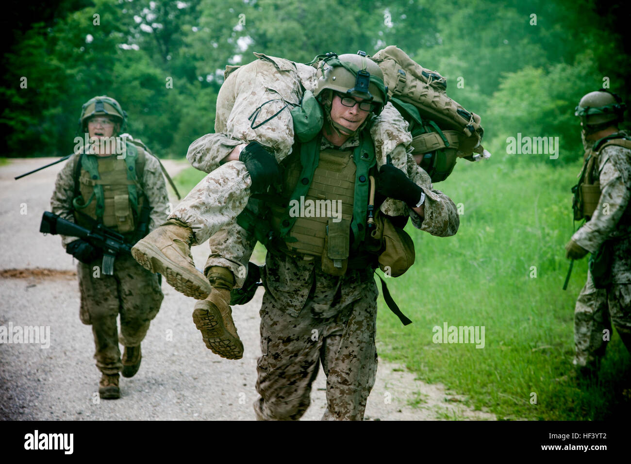 A U.S. Marine attending the Military Police Basic Course carries a ...