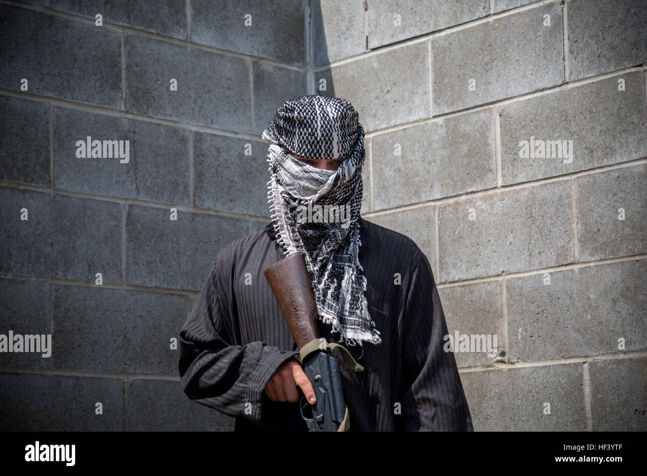 A U.S. Marine acting as an Opposing Force, helps to provide real-world ...