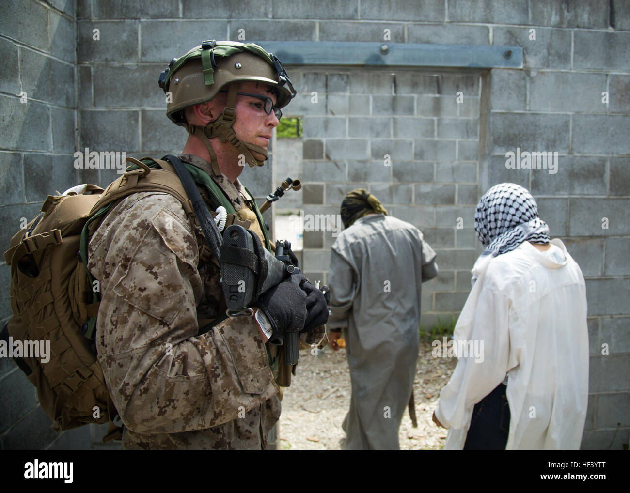 A U.S. Marine attending the Military Police Basic Course, conducts ...