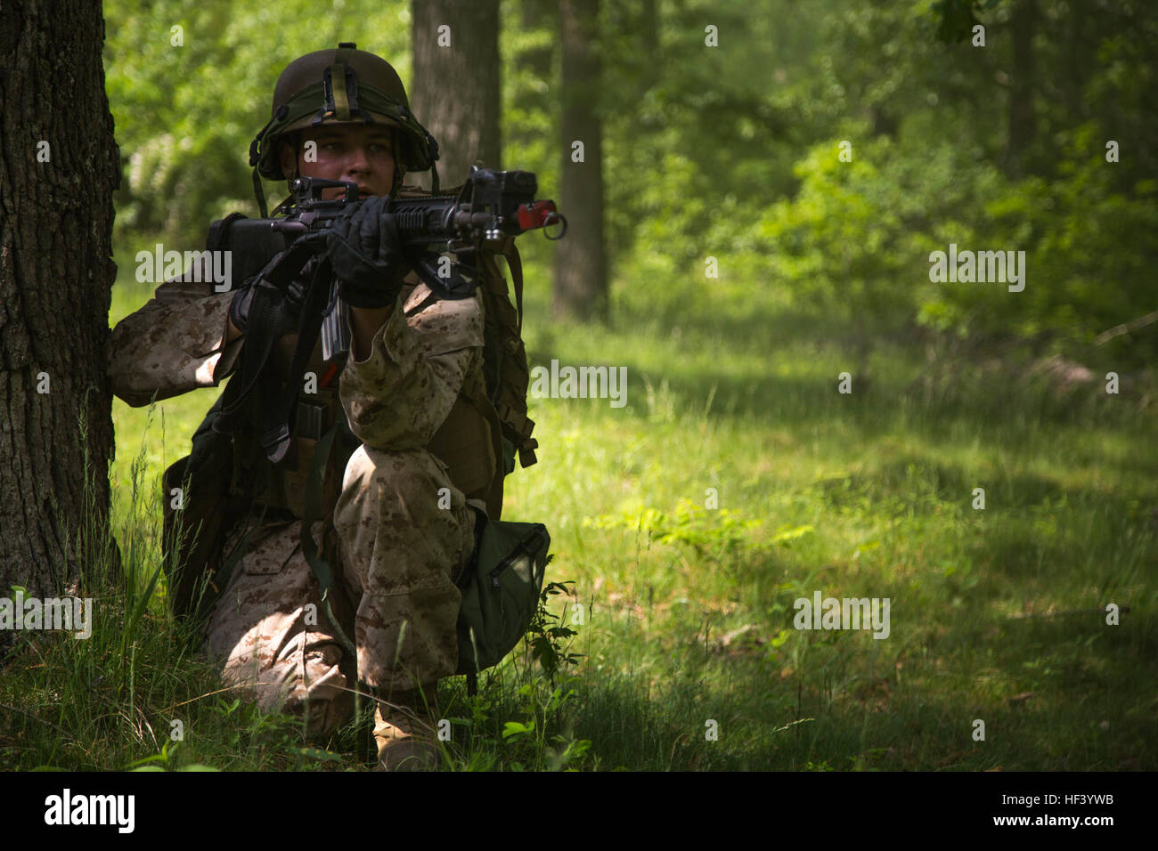 A U.S. Marine attending the Military Police Basic Course, provides ...