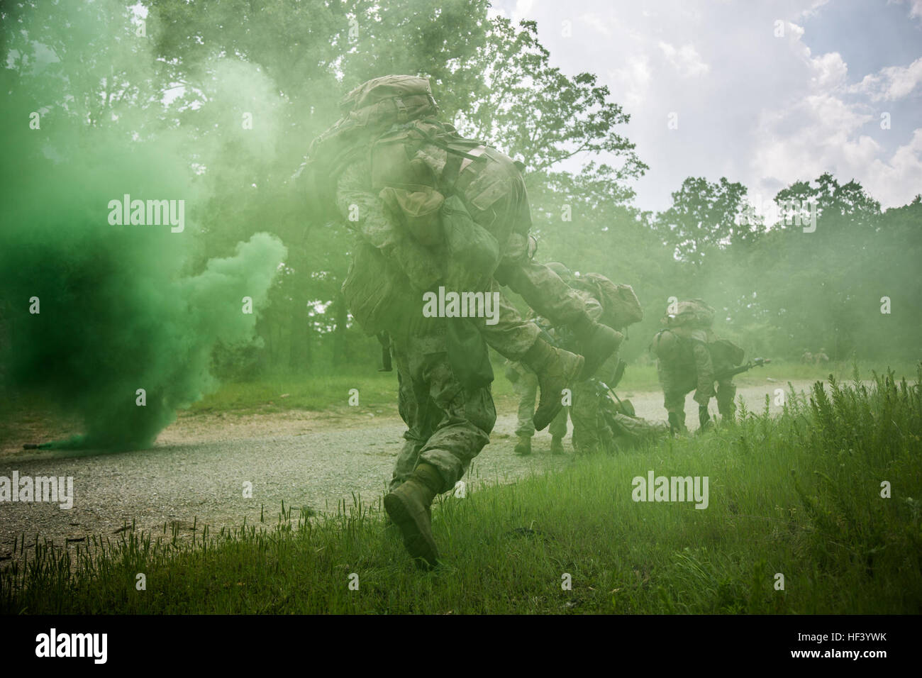 A Marine attending the Military Police Basic Course carries a simulated ...