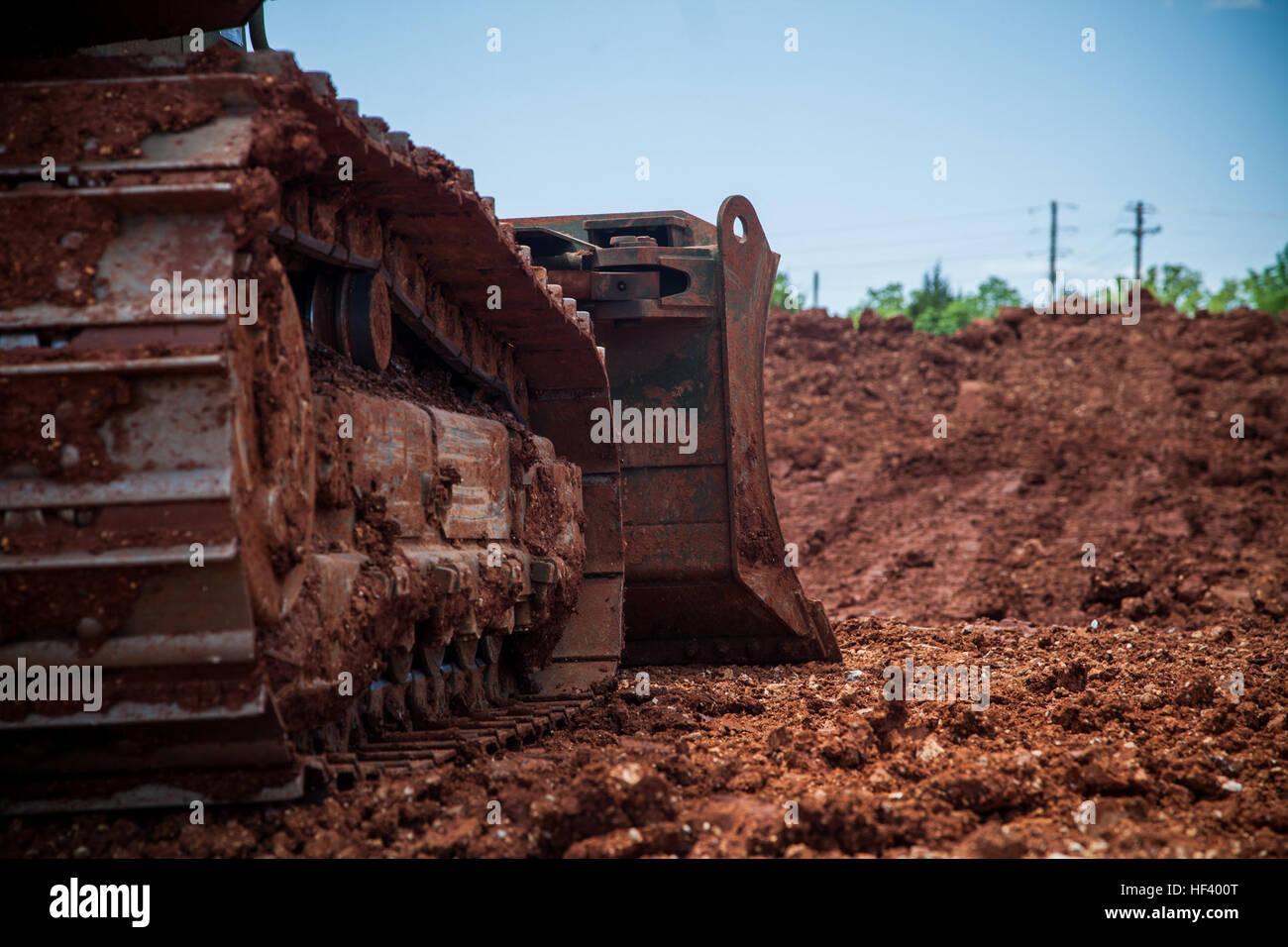 A D6K medium track-type tractor is staged in the mud during a training ...