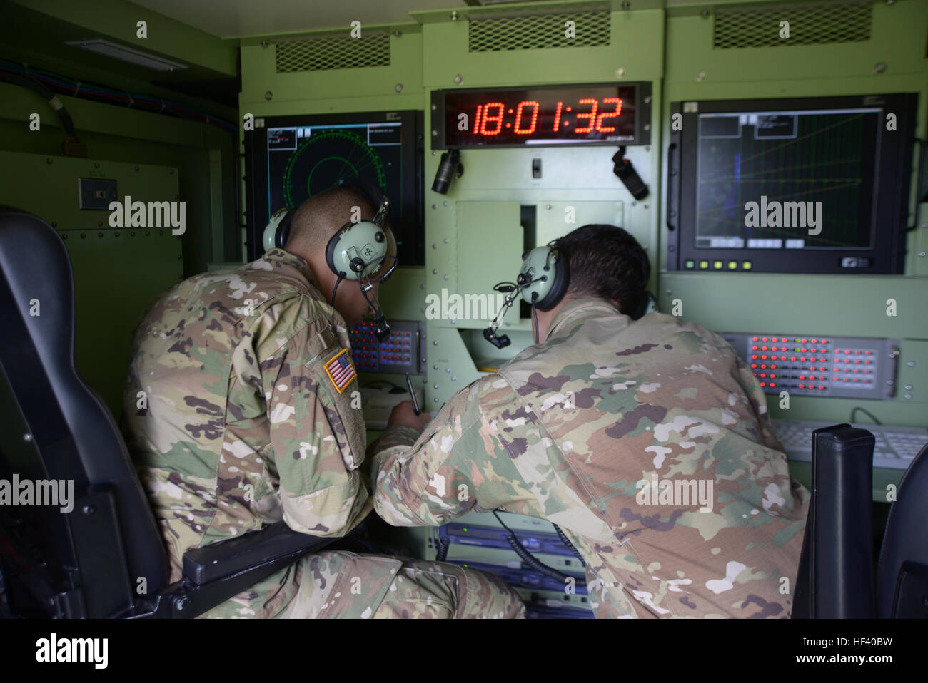 U.S. Army Spc. Javier Steele (left), a ground control approach operator ...
