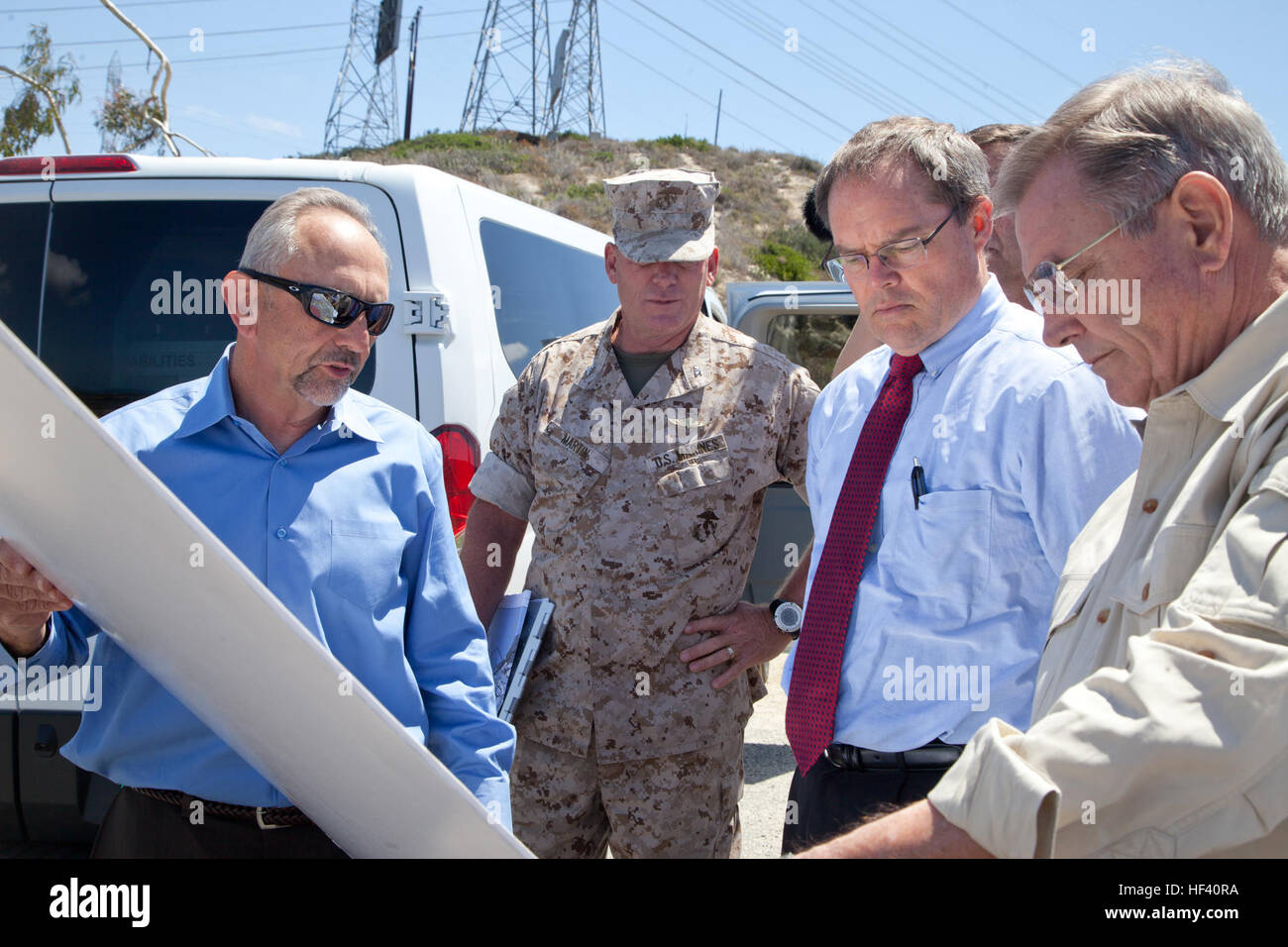 A senior Department of the Navy official surveys a map at Marine Corps ...
