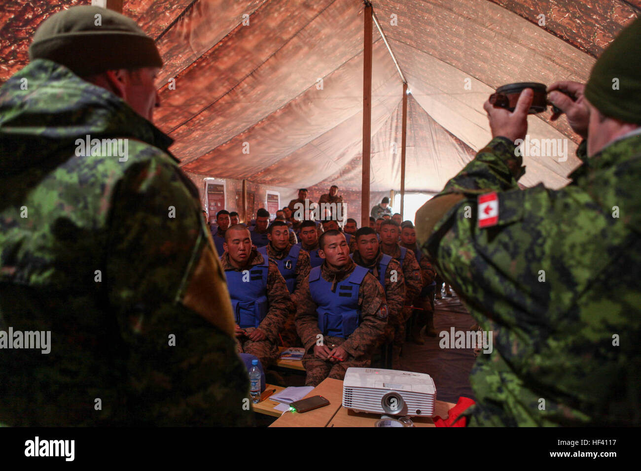 Explosive ordnance disposal soldiers with the Canadian Army give an ...
