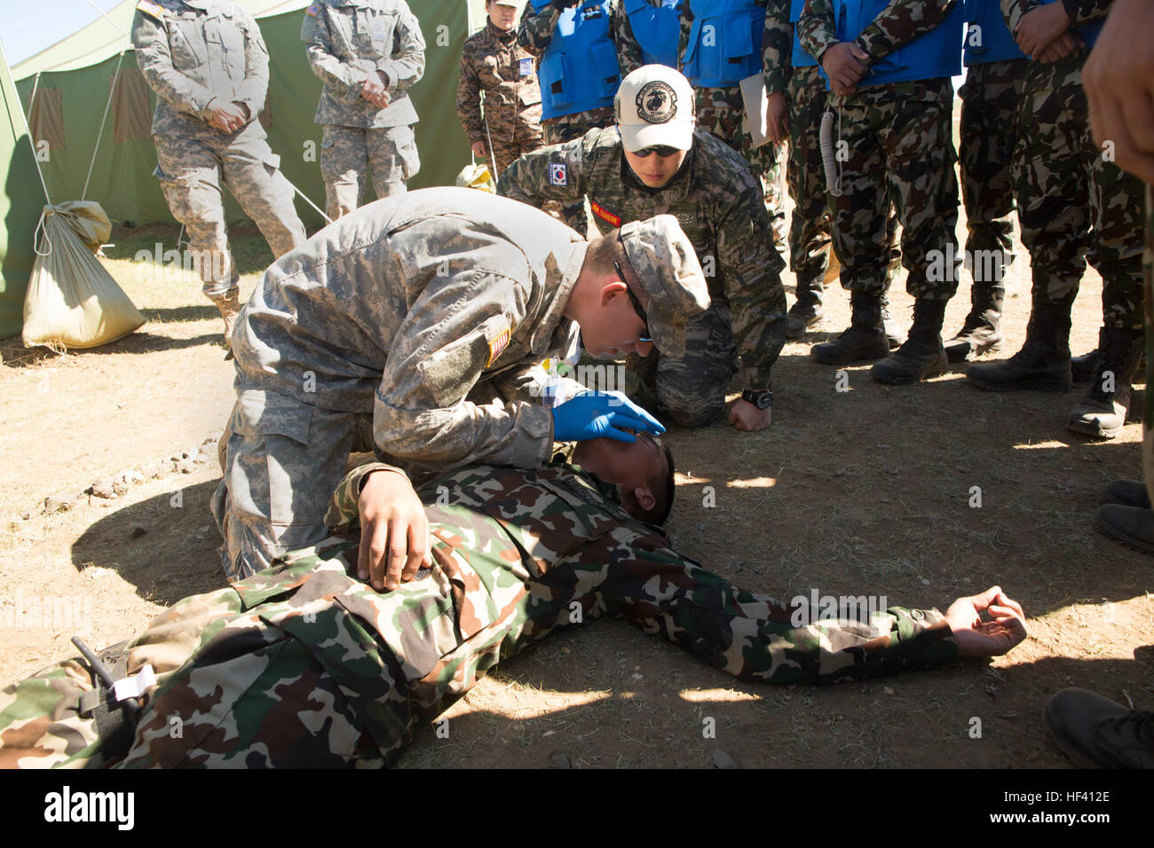 U.S. Army Sgt. Stephen Behrens, left, simulates opening Nepalese ...
