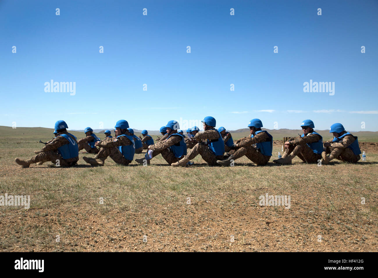 Soldiers of the Mongolian Armed Forces await their turn for evaluation ...