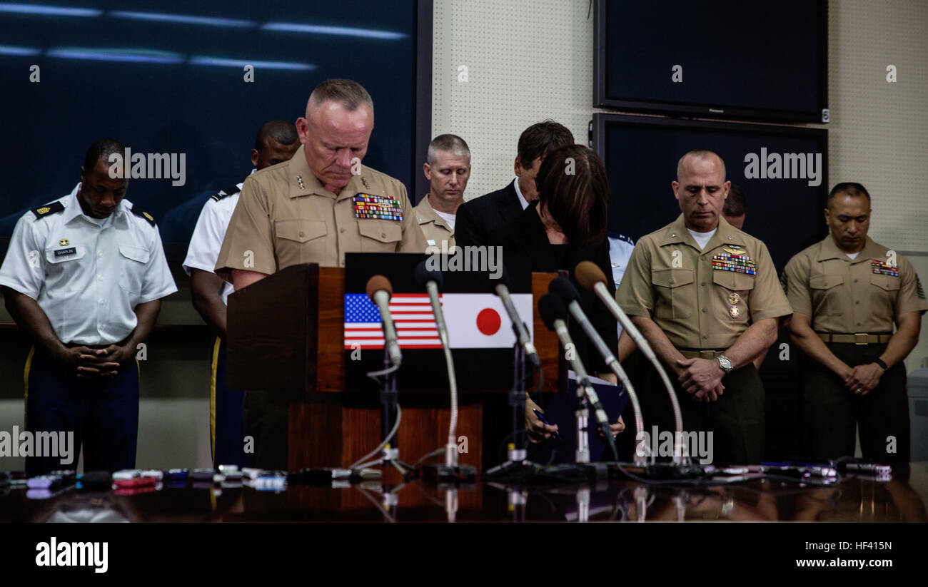Lt. Gen. Lawrence D. Nicholson holds a moment of silence as he ...