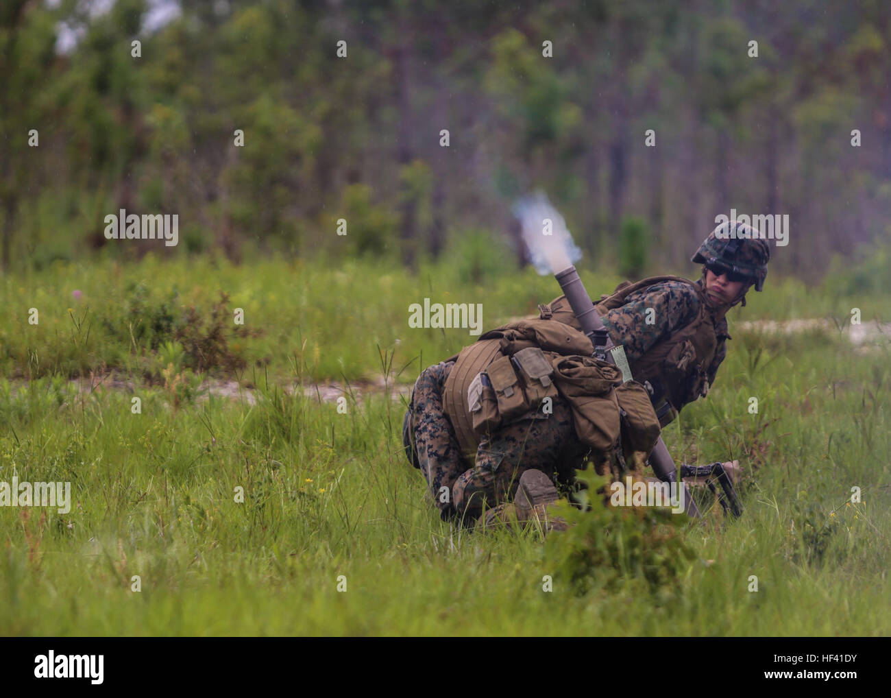 A mortar team with 1st Battalion, 2nd Marine Regiment, take cover on ...