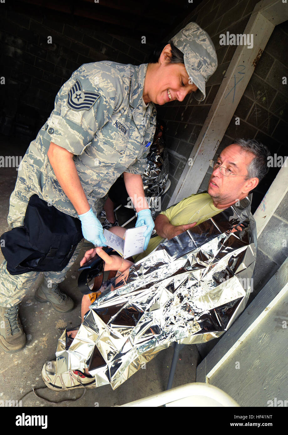 Oregon Air National Guard Tech. Sgt. Paula Hodgson helps a victim in a ...