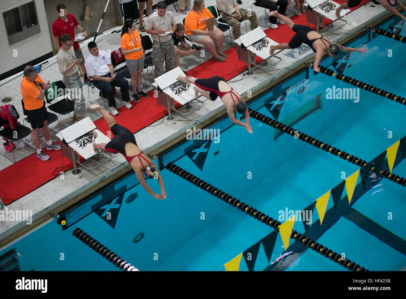 Members of Team Marine Corps and a member of Team Army dive into the ...