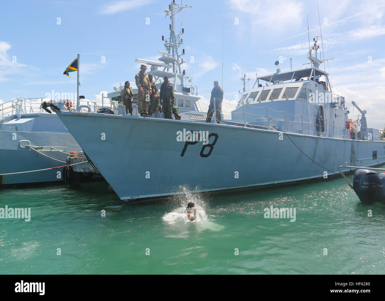 A soldier dives into the water while conducting amphibious training ...