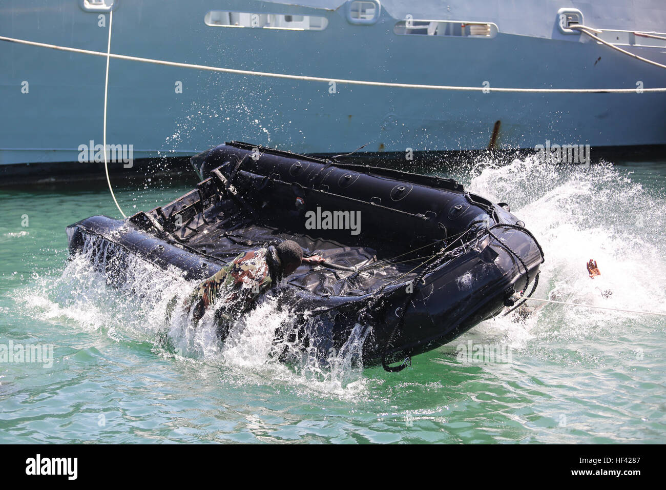 A Guyana service member conducts amphibious training aboard a Rigid ...
