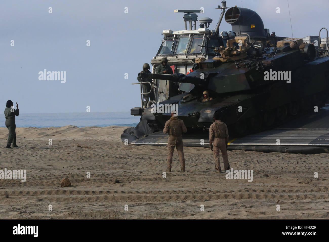 A Marine with 1st Tank Battalion, 1st Marine Division drives an M1A1 ...