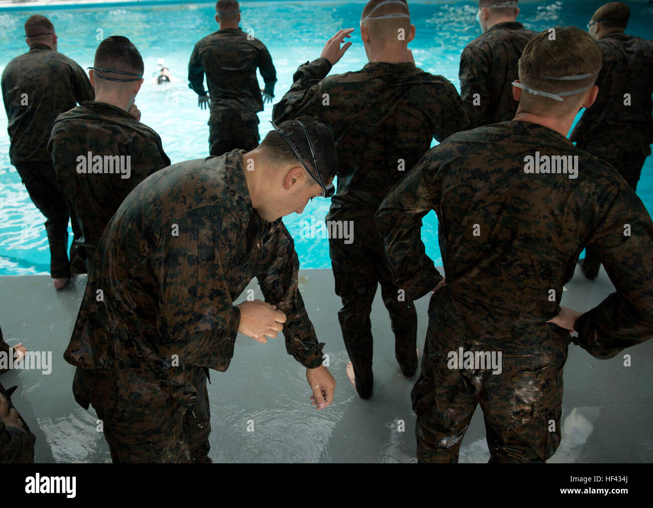 Marines prepare to swim during advanced water survival training Aug. 4 ...