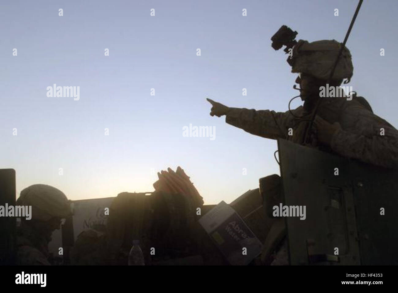 USMC Captain, Forward Air Controller, points toward the next location ...