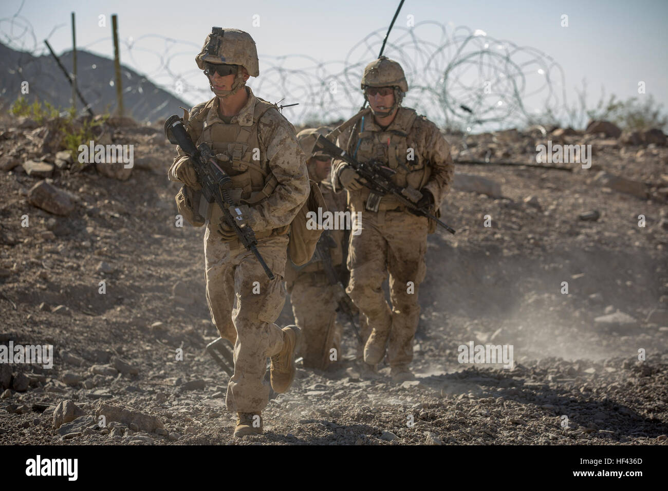 Marines with 2nd Battalion, 5th Marine Regiment, move to provide cover ...
