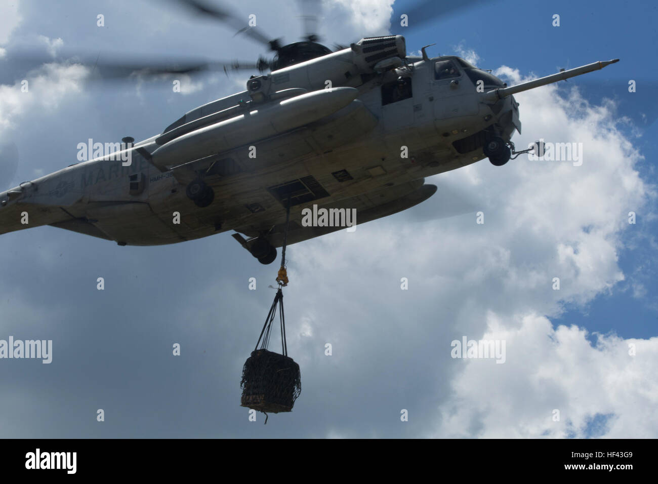 A CH-53 Super Stallion helicopter conducts an air resupply of tank ...
