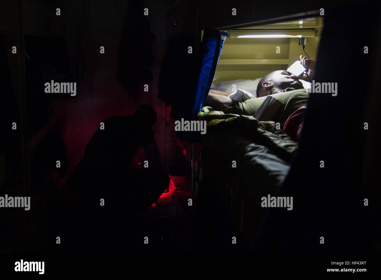 Marines with the 24th Marine Expeditionary Unit rest in their berthing ...