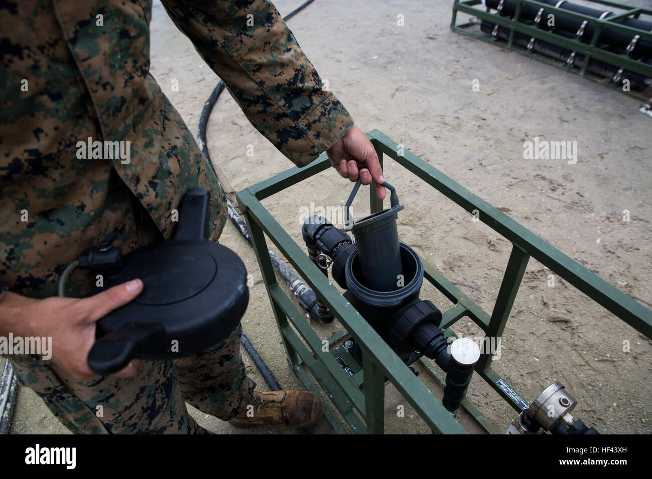 A Marine with Engineer Platoon, Combat Logistics Battalion 24 checks ...