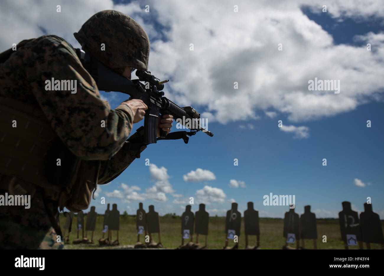 A U.S. Marine fires at his target during a table three range at Camp ...