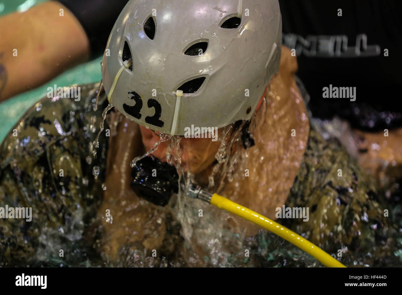 A Marine emerges from the water during a training exercise at Camp ...