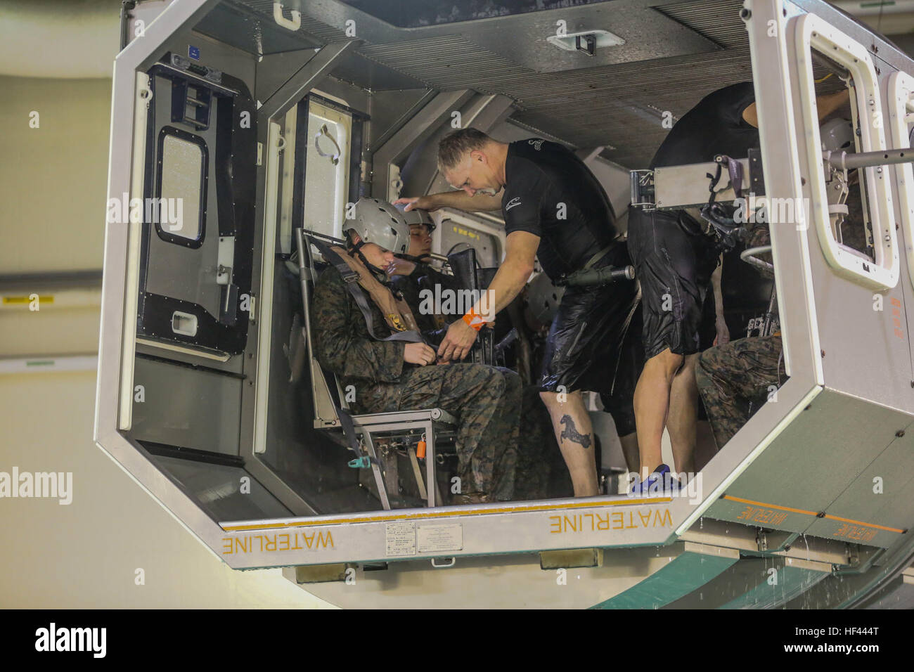 Marines prepare to be submerged during a training exercise at Camp ...