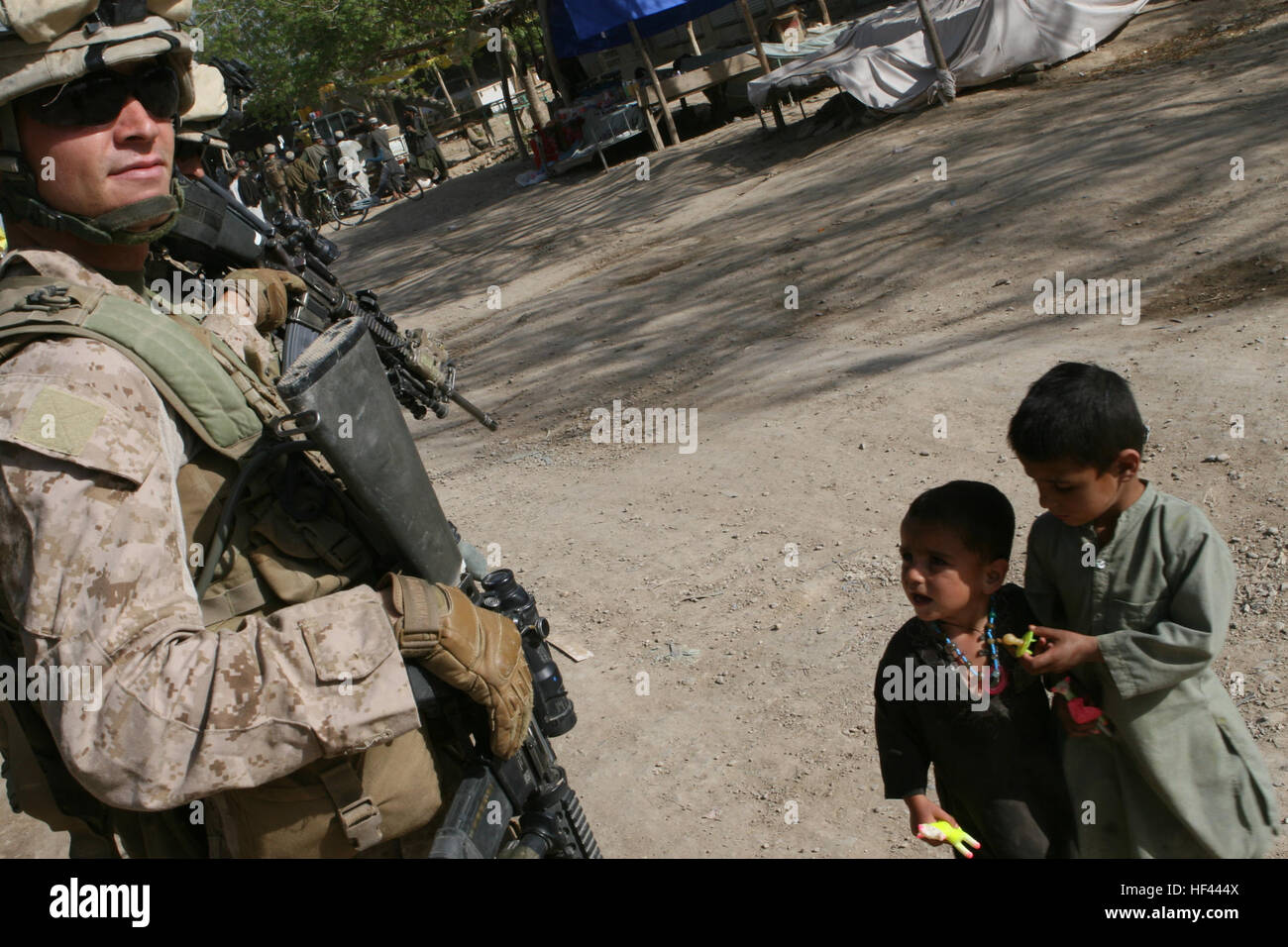 Sgt. Daniel Pluth, from San Marcos, Texas, patrols the city of Marjah ...