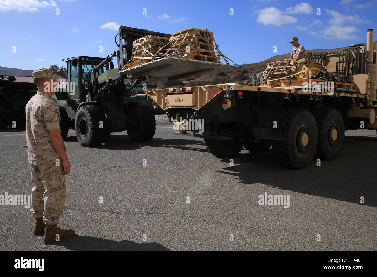 U.S. Marines from Combat Logistics Regiment 15 properly place pallets ...