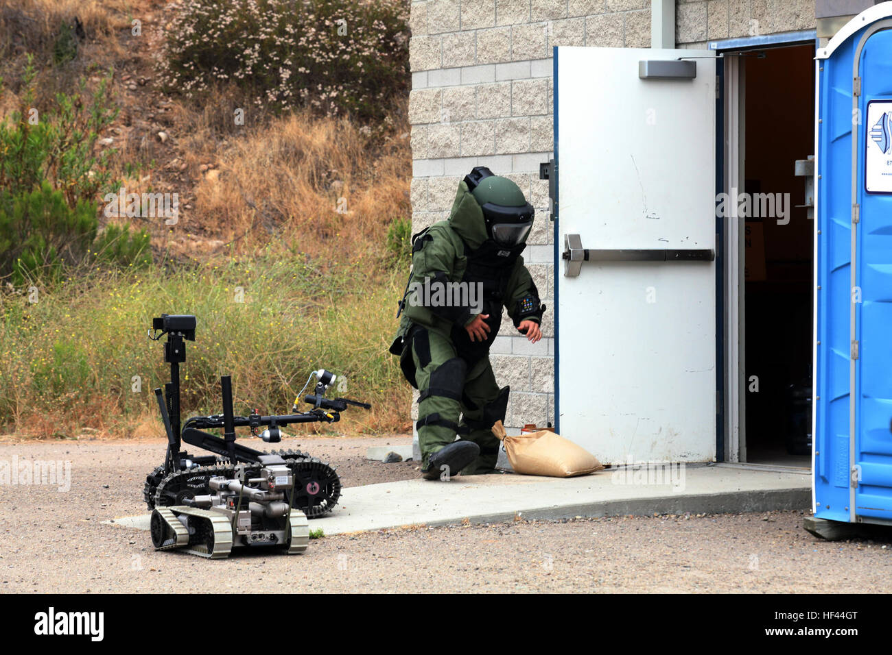 An Explosive Ordnance Disposal Marine wears a bomb suit for protection ...