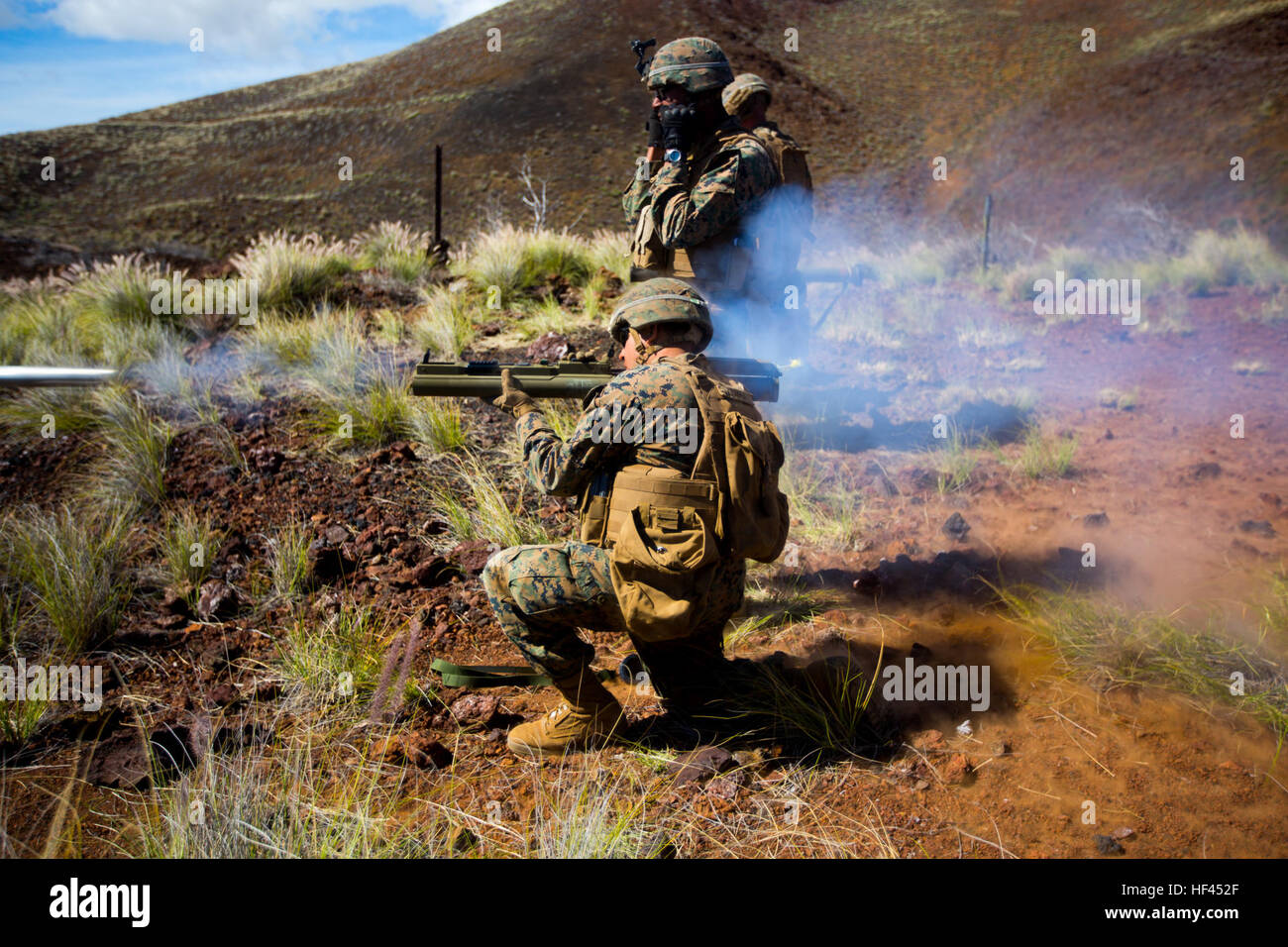 A Marine from Charlie Company, 1st Battalion, 3rd Marine Regiment fires ...