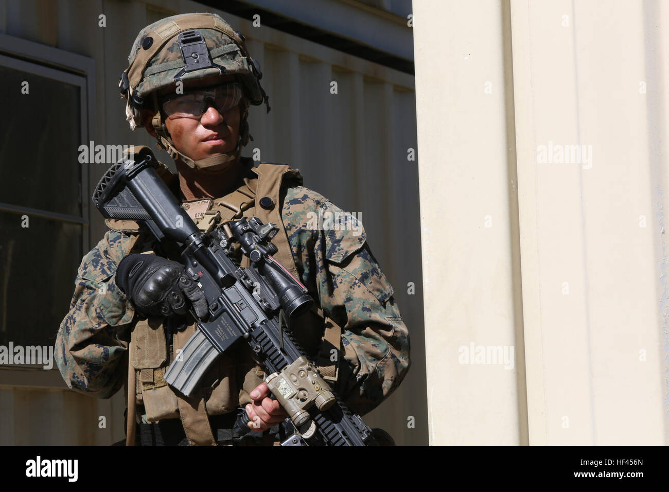 A Marine from Kilo Company, 3rd Battalion, 8th Marine Regiment, stands ...