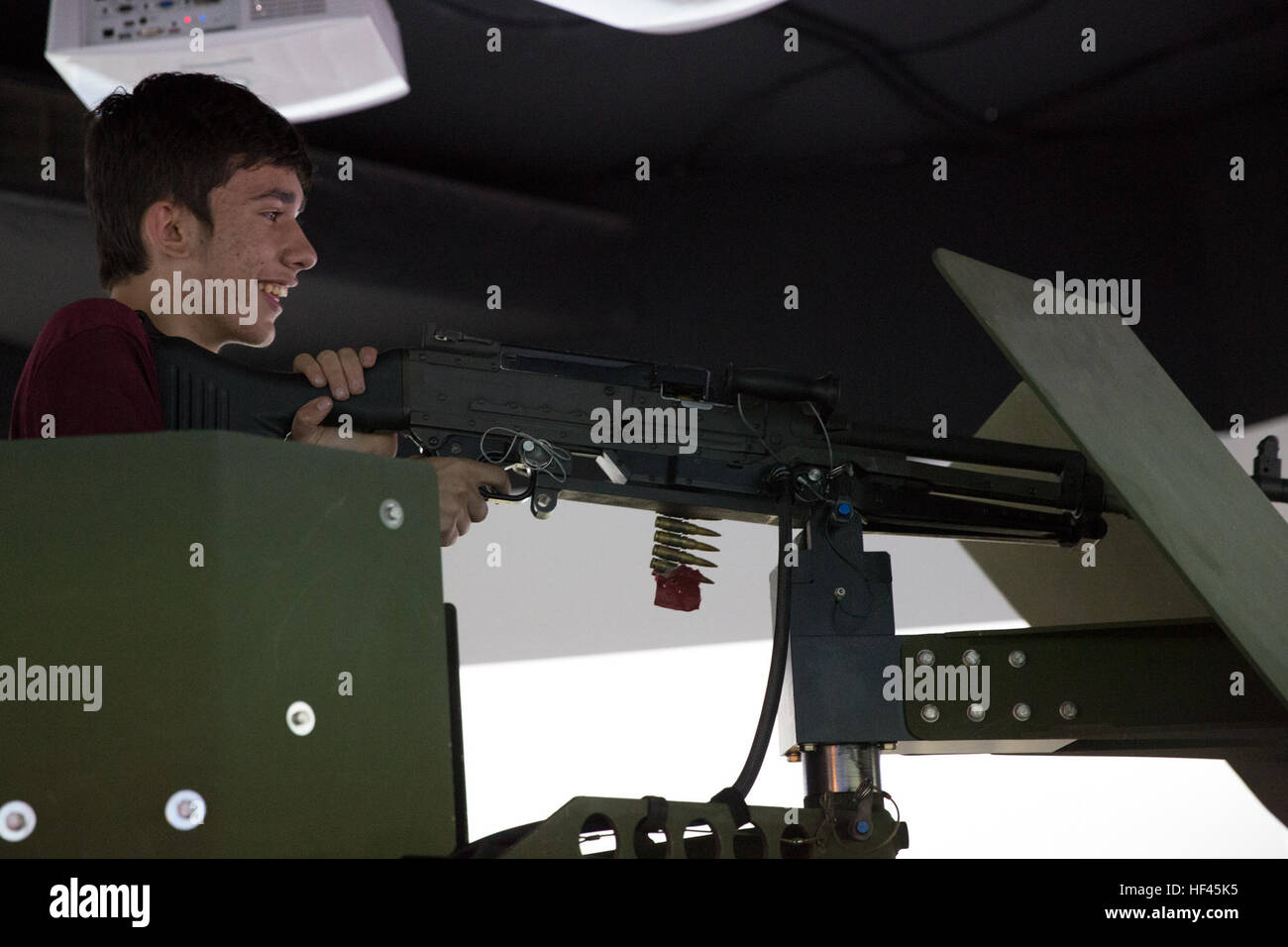Jordan Foley, Boy Scout, Troop 377, fires a M249 Squad Automatic Weapon ...