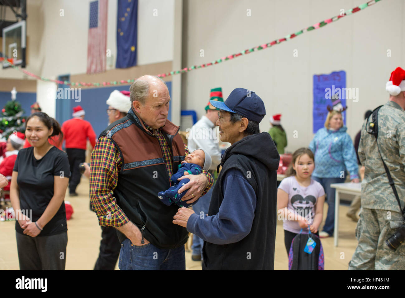 Alaska Governor Bill Walker speaks with a Togiak elder in the local ...