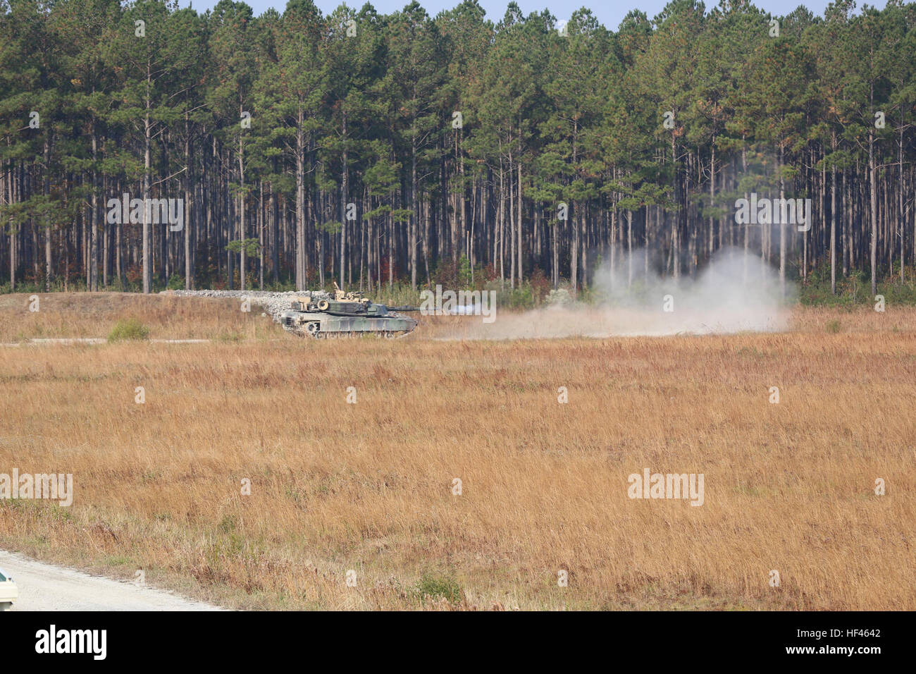 Marines fire rounds from an M1A1 Abrams tank during a gunnery range ...