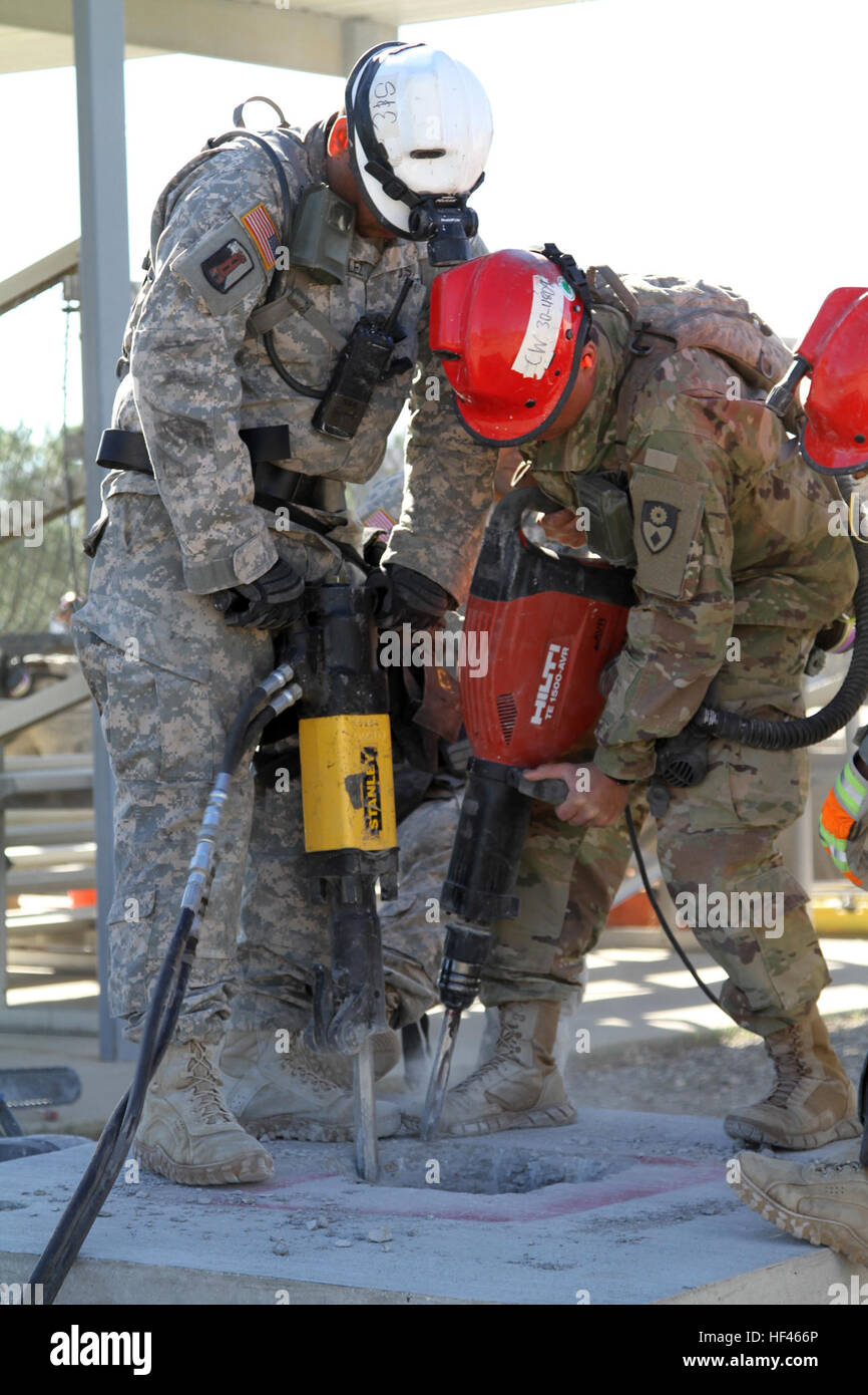 Engineers with the 235th Engineer Company (Sapper) use jack hammers to ...