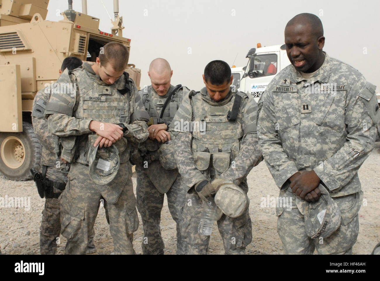 Capt. Peter Pritchett, chaplain, says a prayer with the Soldiers of ...