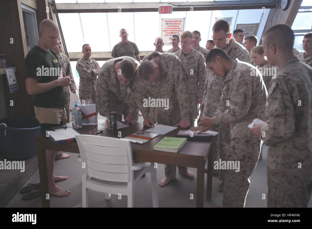U.S. Marines attached to 2d Marine Aircraft Wing (2d MAW) sign a roster ...