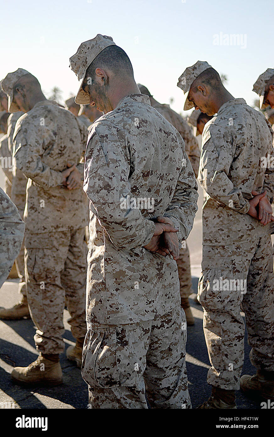 Recruits of Company K bow their heads to pray during the Emblem ...