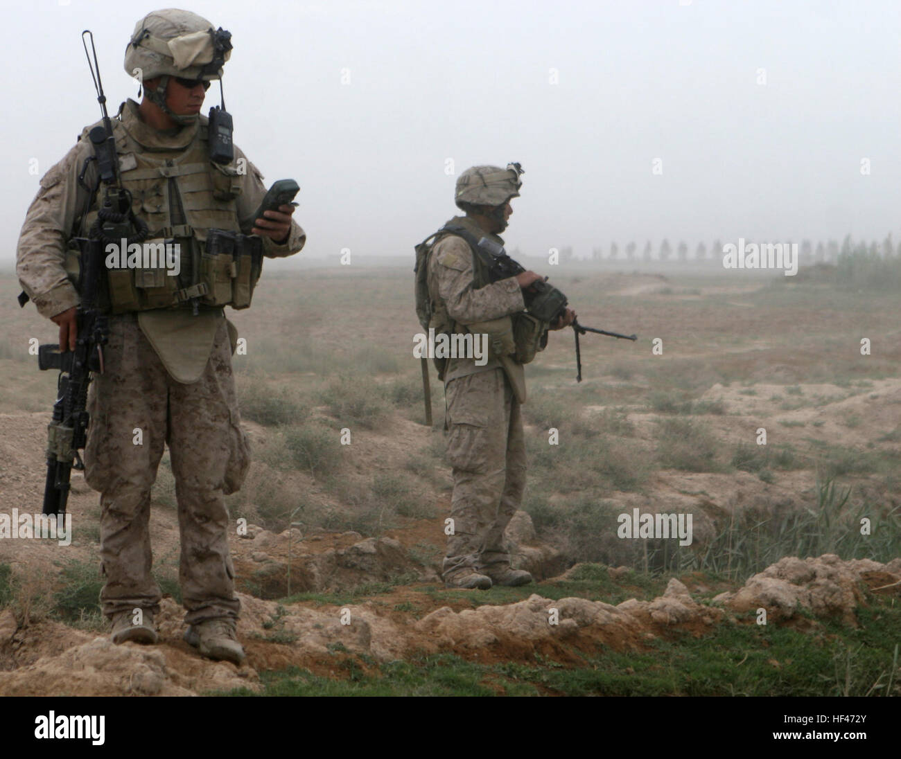 Pfc. Justin Gomez (right), a machine gunner with Kilo Company, 3rd ...
