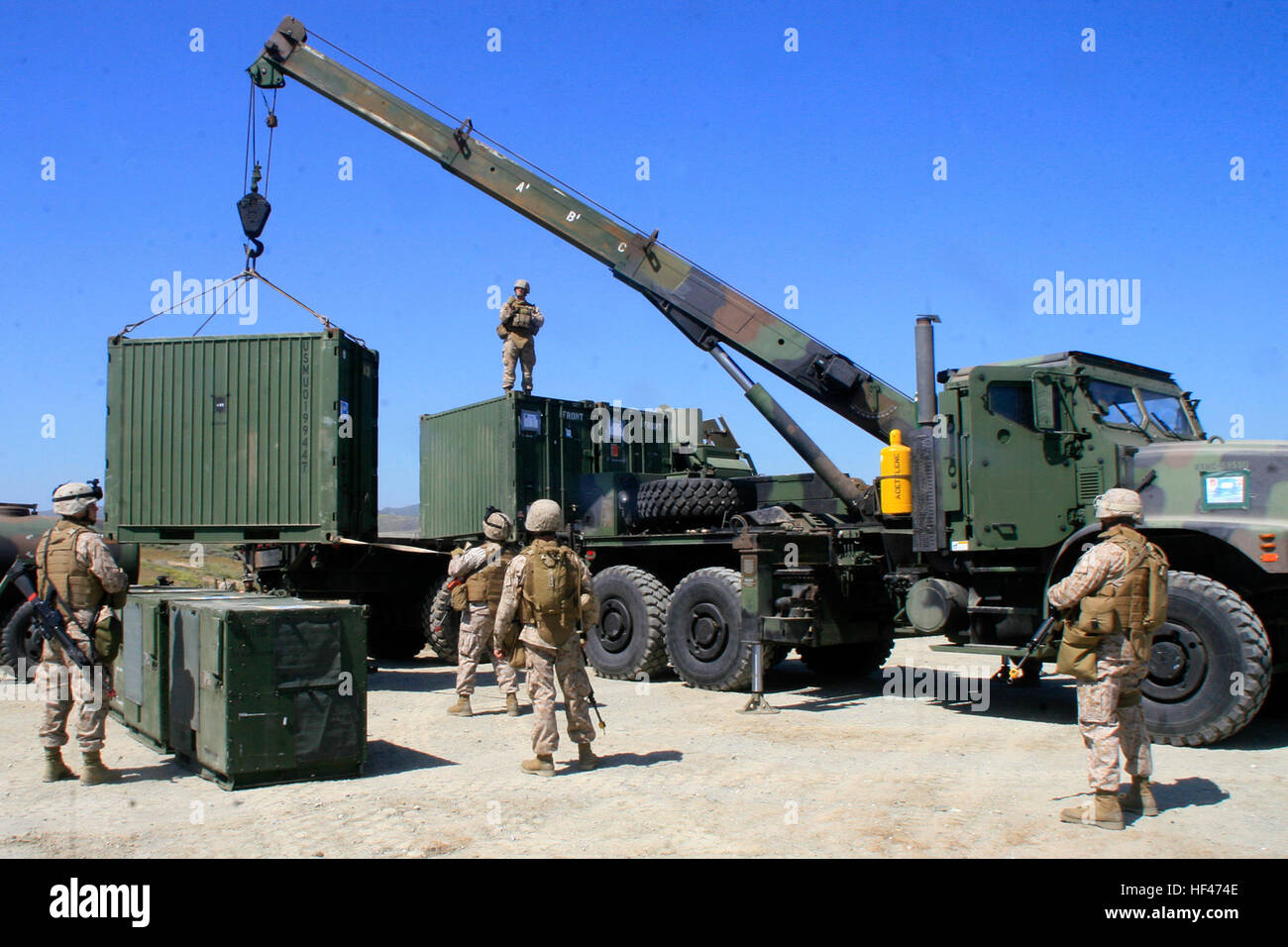 Marines and sailors from Combat Logistics Battalion 15 load QUADCON ...