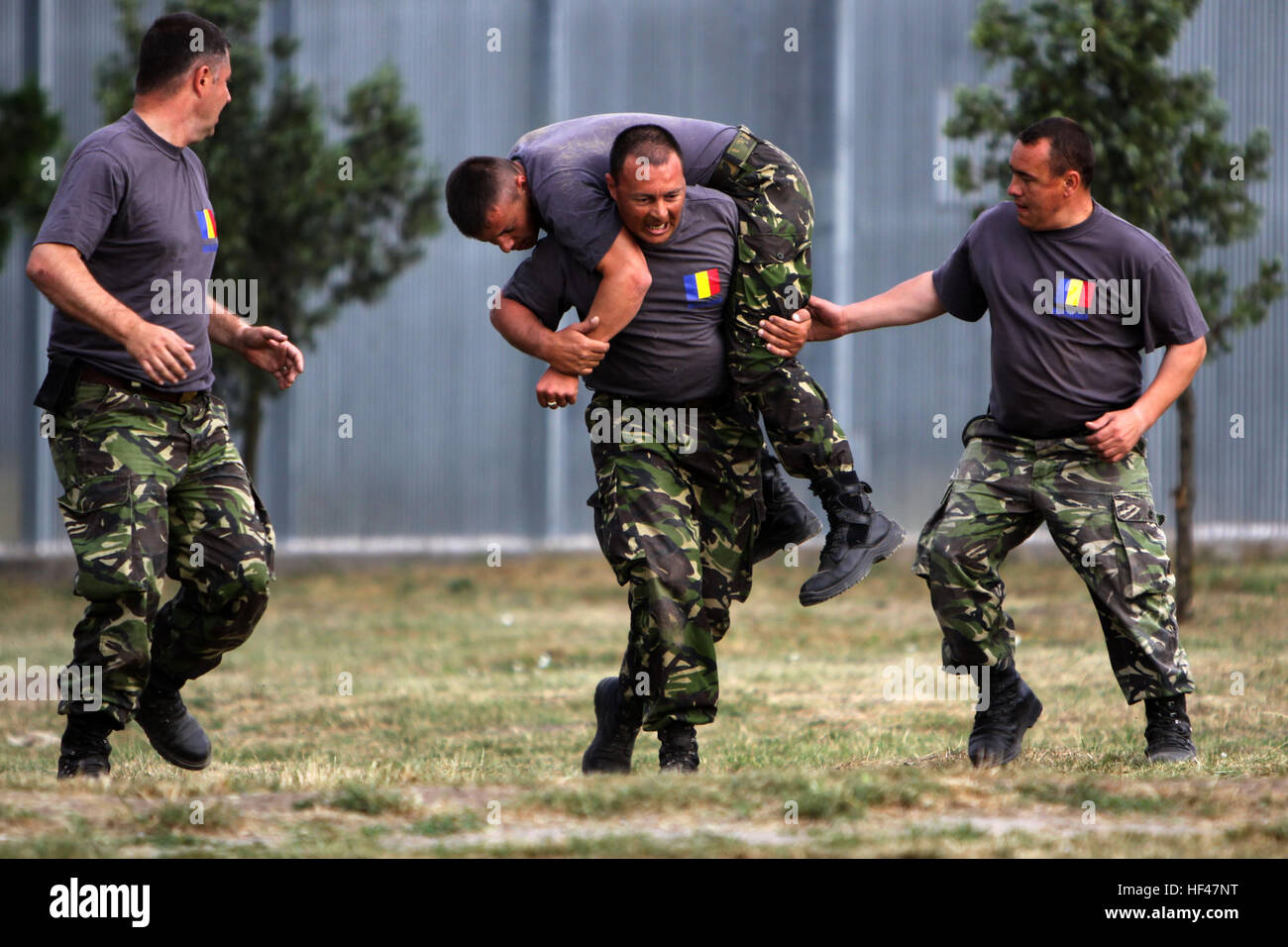 Romanian army soldiers with the 341st Battalion, make their way to a ...