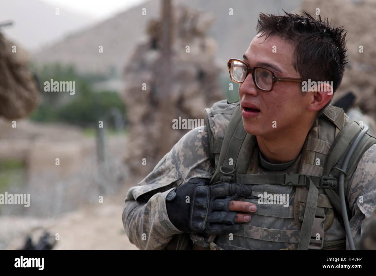 U.S. Army Pfc. Michael Duran catches his breath just after arriving back at his outpost after a ...