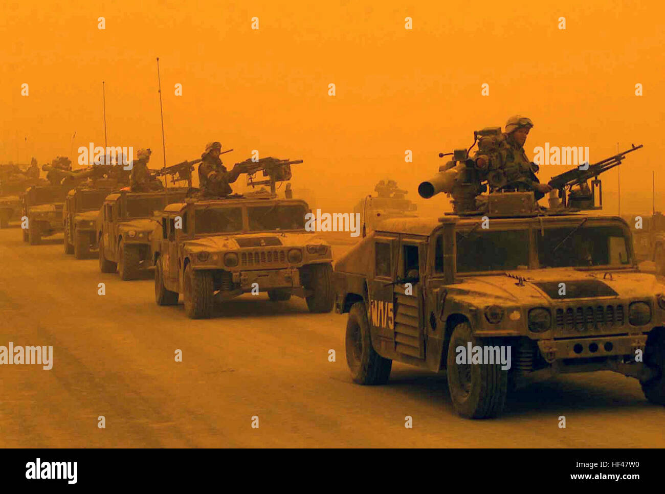 A convoy of US Marine Corps (USMC) High-Mobility Multipurpose Wheeled ...